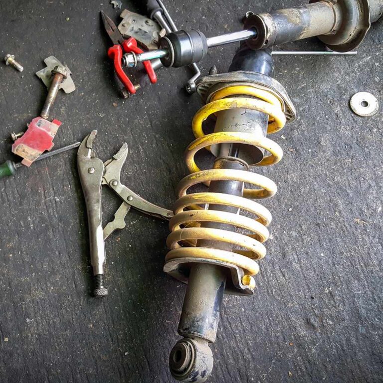 Why Is My Car Squeaking When I Go Over Bumps? Causes and Solutions